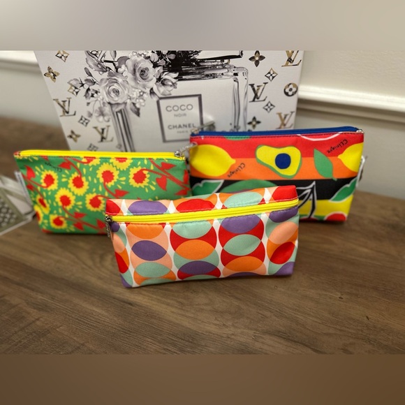 Clinique | Bags | Clinique Colorful Patterned Cosmetic Pouches Set Nwot ...